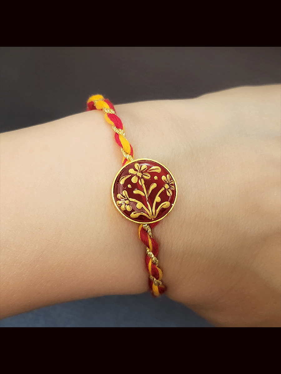 Round maroon and green stone(1.75cm) gold work mauli thread rakhi ...